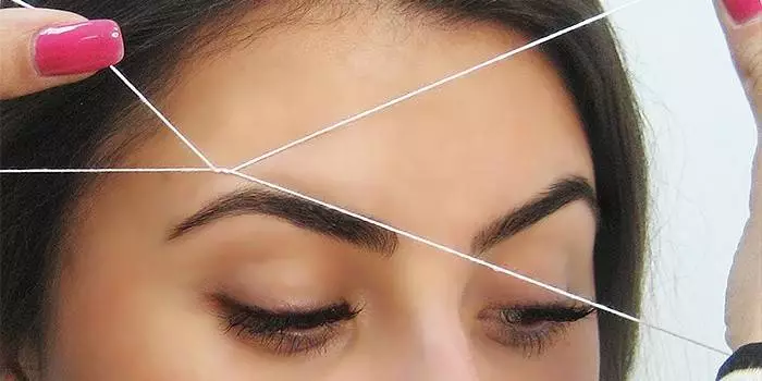 Eyebrow shaping with thread