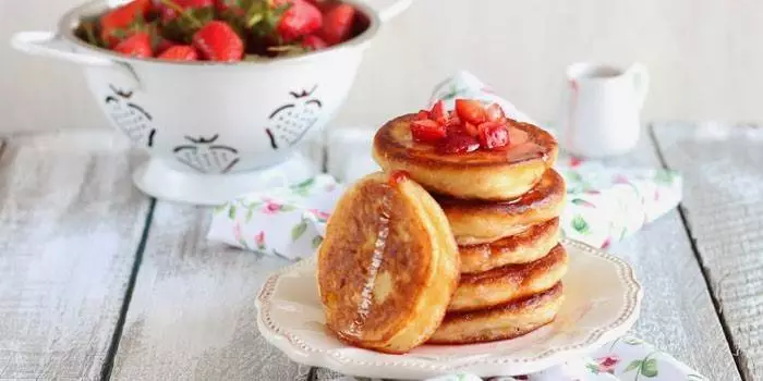 Fried yeast pancakes with strawberry jam