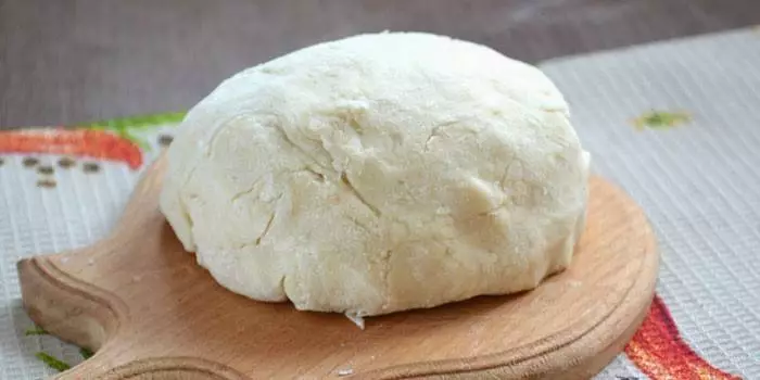 Ball of choux pastry on a cutting board