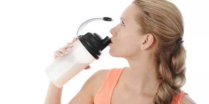 Girl drinking protein shake