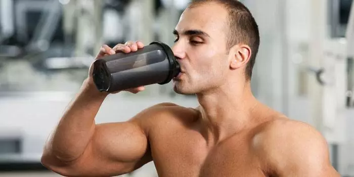 A man drinking a protein shake