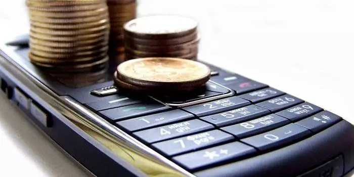 Мобилен телефон и монети