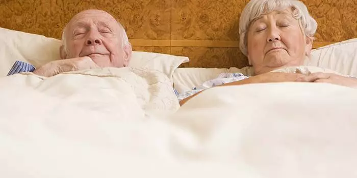 Elderly couple sleeping