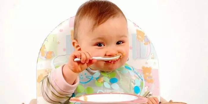 Child eating porridge