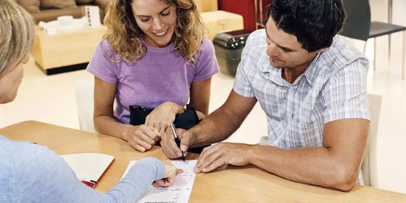 People sign documents