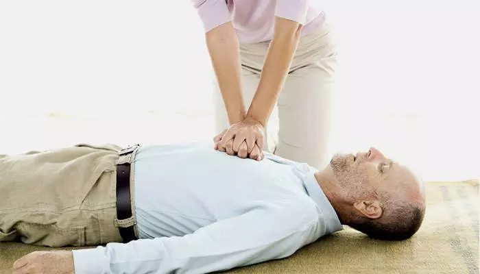 A woman gives a man an indirect massage